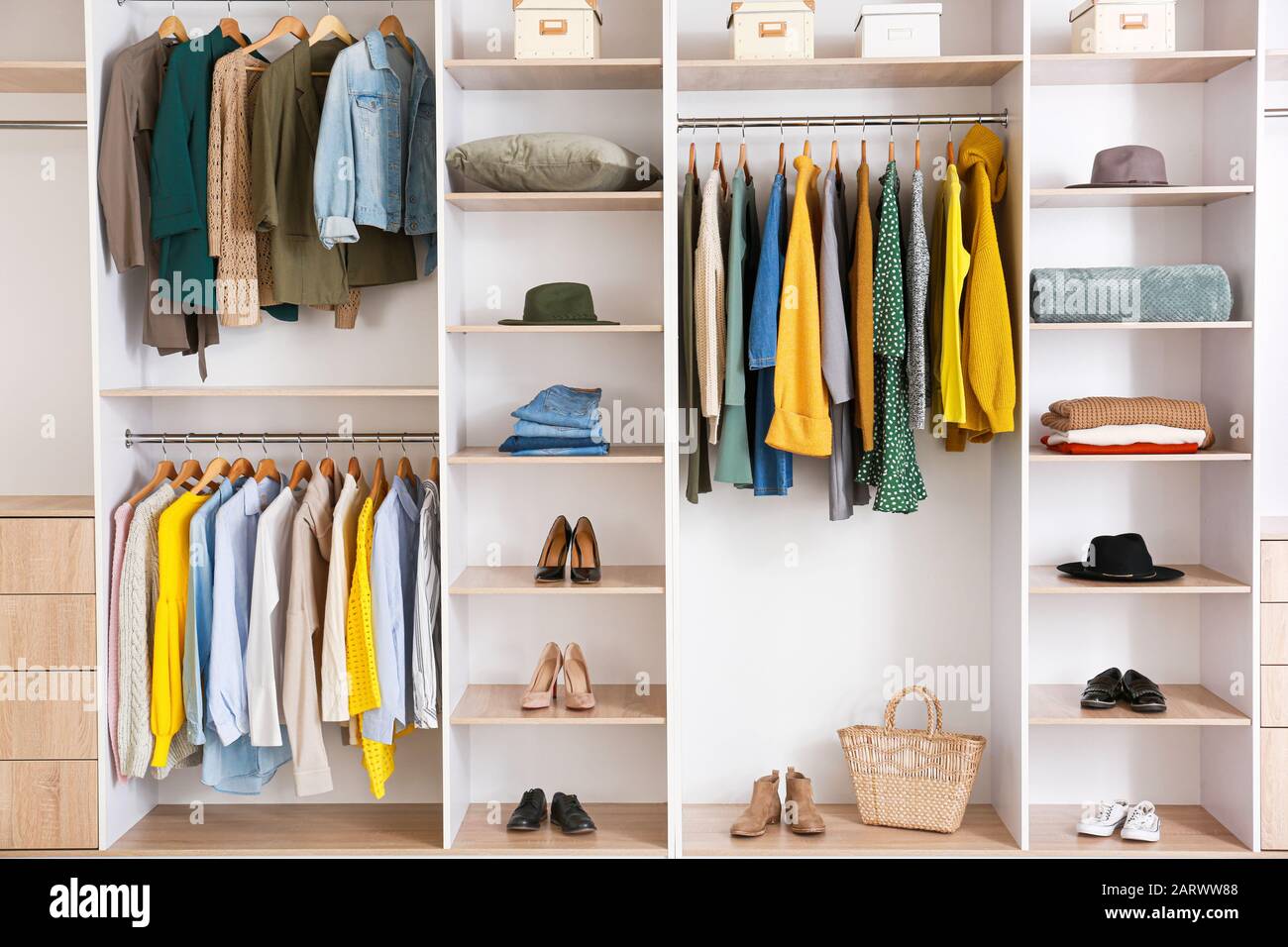 Big wardrobe with clothes in dressing room Stock Photo - Alamy