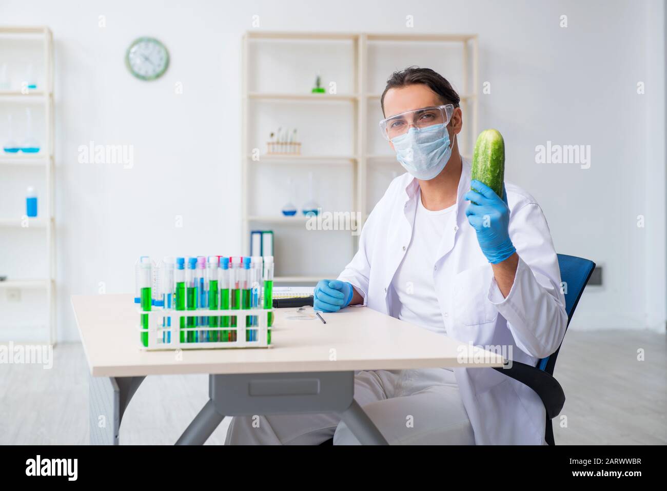 The male nutrition expert testing vegetables in lab Stock Photo - Alamy