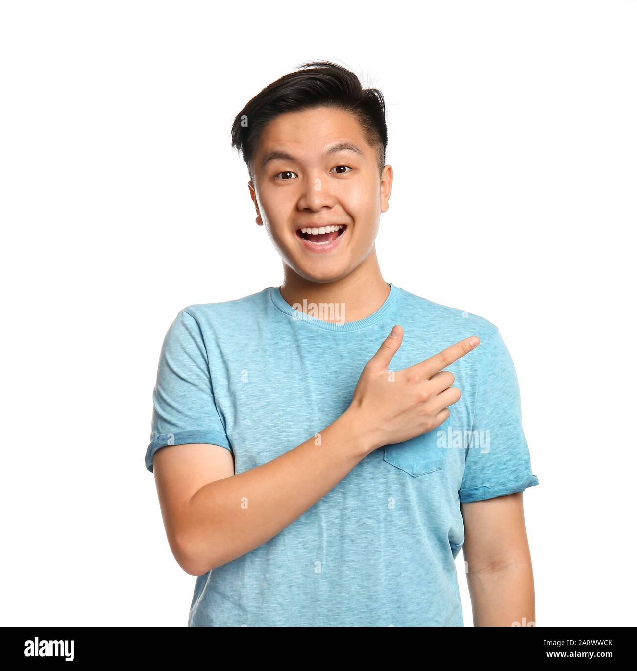 Portrait of Asian man pointing at something on white background Stock ...