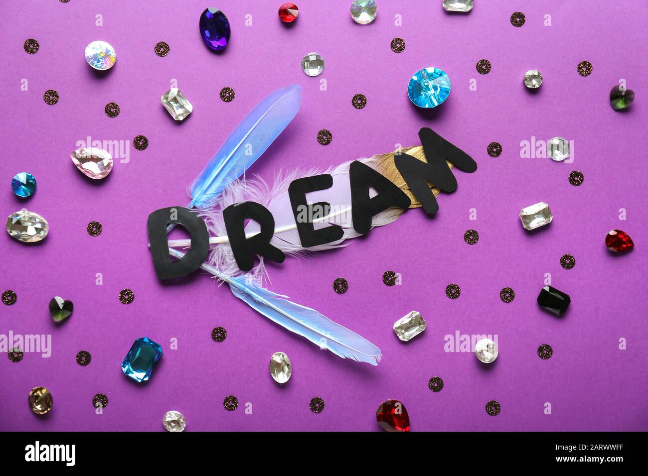 Word DREAM with precious stones on color background Stock Photo - Alamy