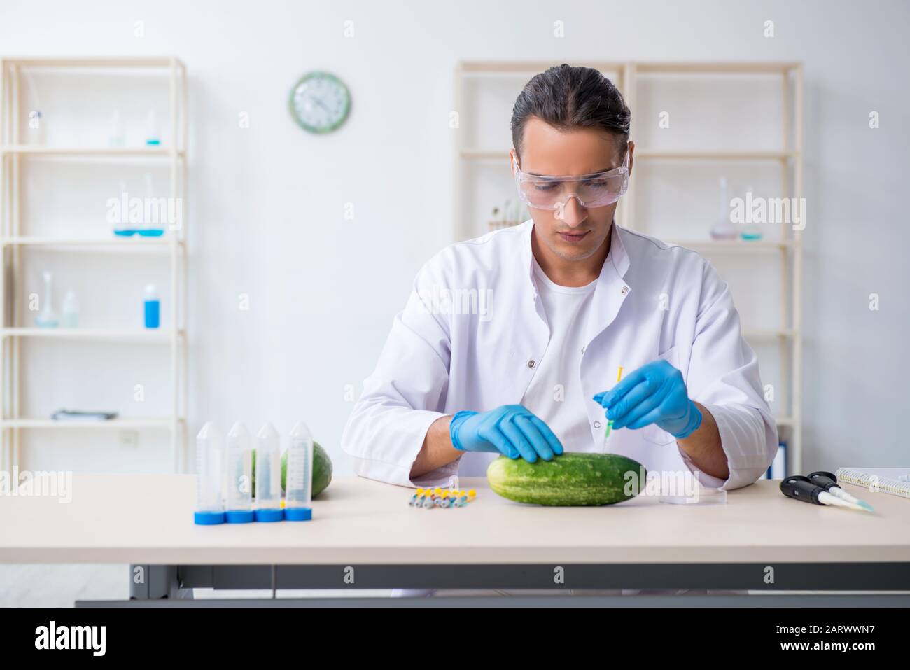The male nutrition expert testing vegetables in lab Stock Photo - Alamy