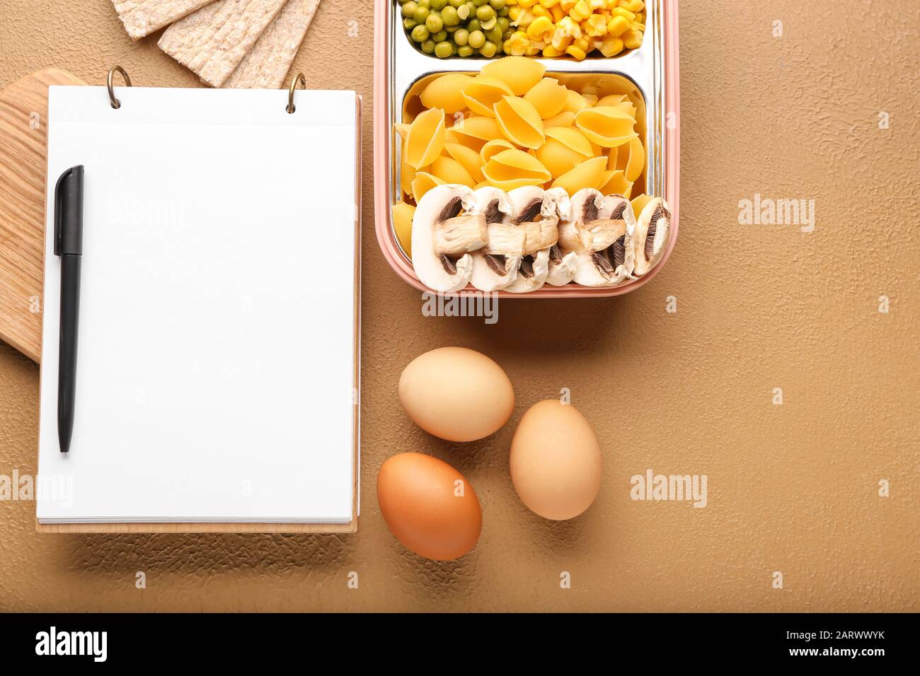 Different healthy food with notebook on color background. Diet plan ...