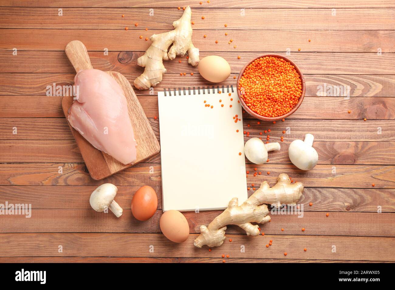 Different healthy food with notebook on wooden table. Diet plan concept ...