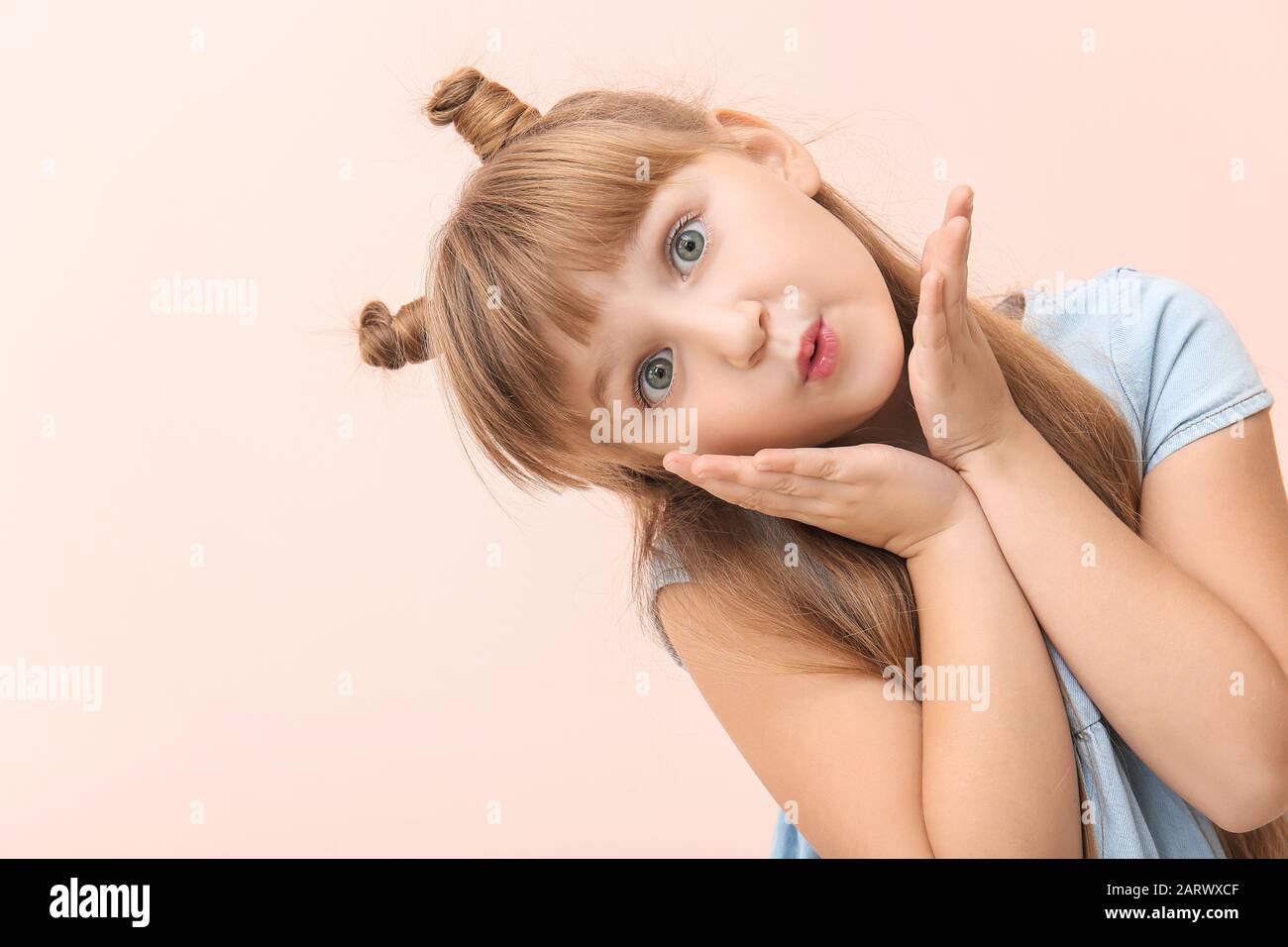 Cute little girl on color background Stock Photo - Alamy