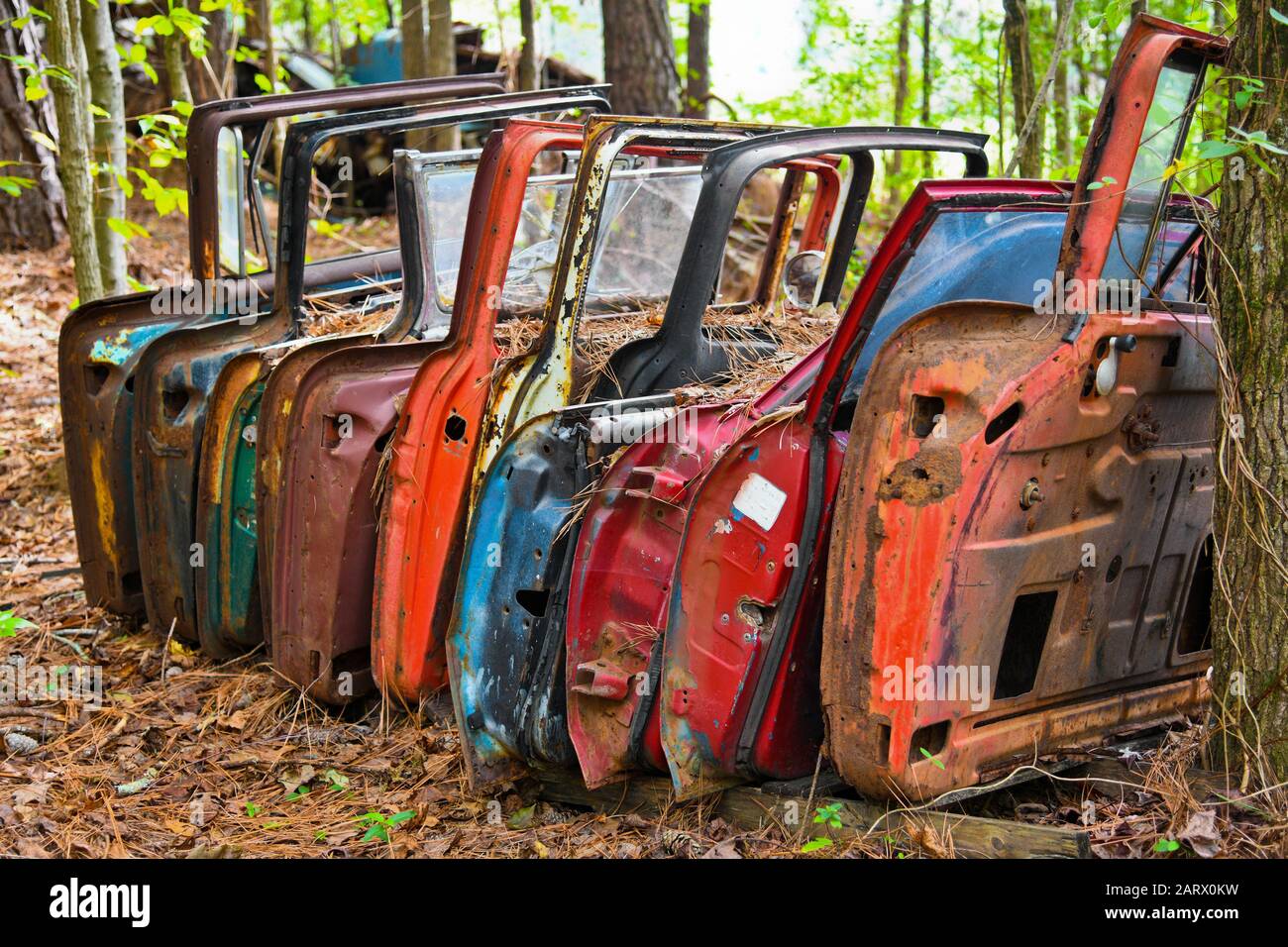 A Row of Old Doors off Scrap Vehicles in a Junk Yard Stock Photo - Alamy