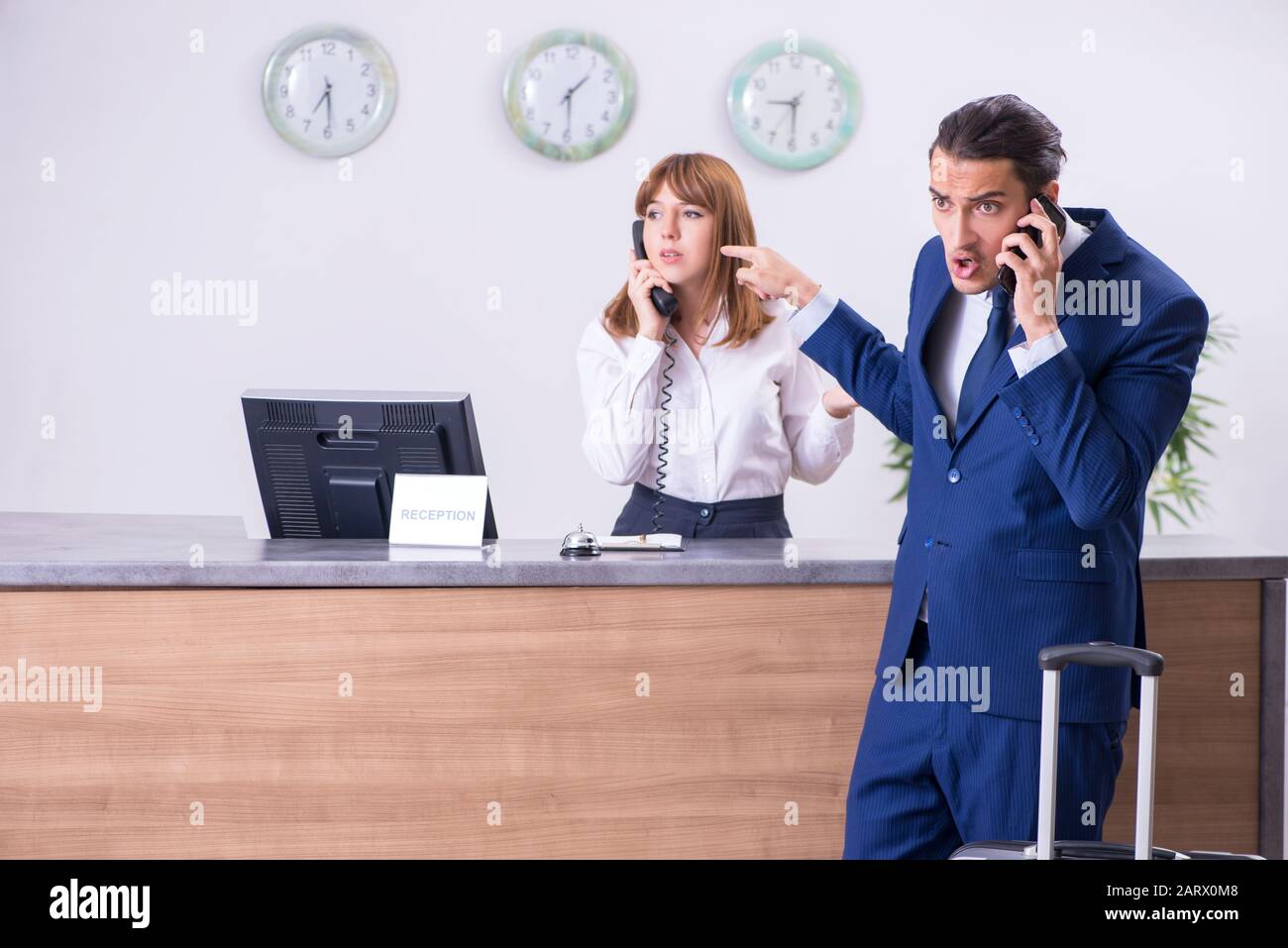 Woman hotel reception angry hi-res stock photography and images - Alamy