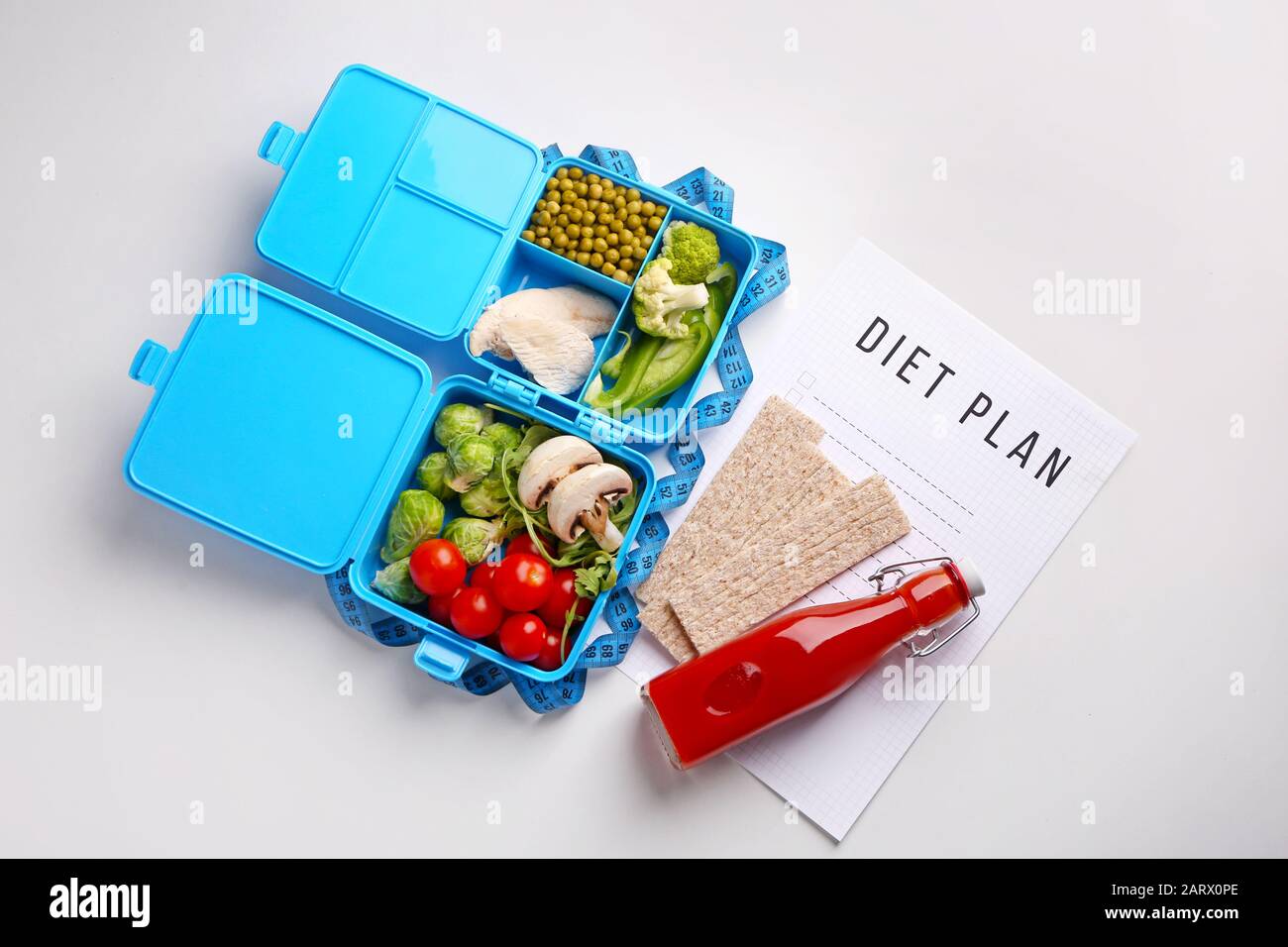 Sheet of paper with diet plan and healthy products on white background ...