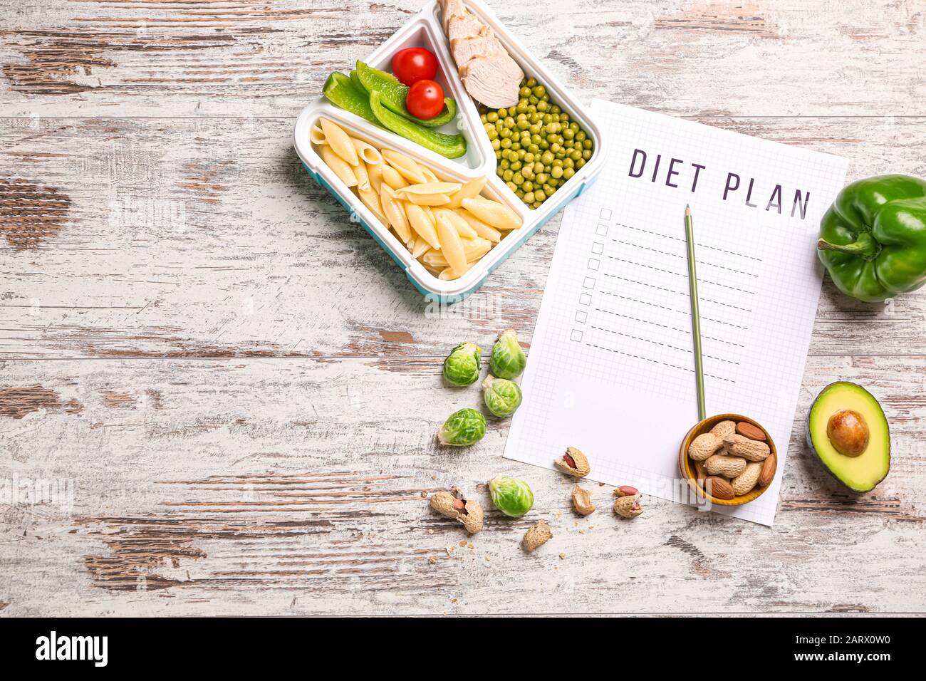 Sheet of paper with diet plan and healthy food on white wooden ...