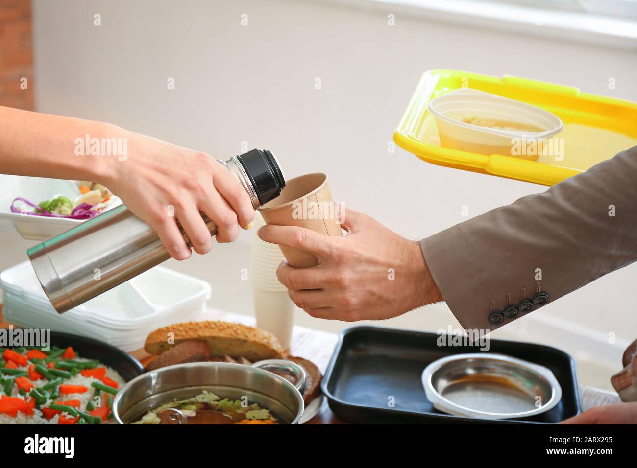 Volunteers giving food to homeless people Stock Photo - Alamy