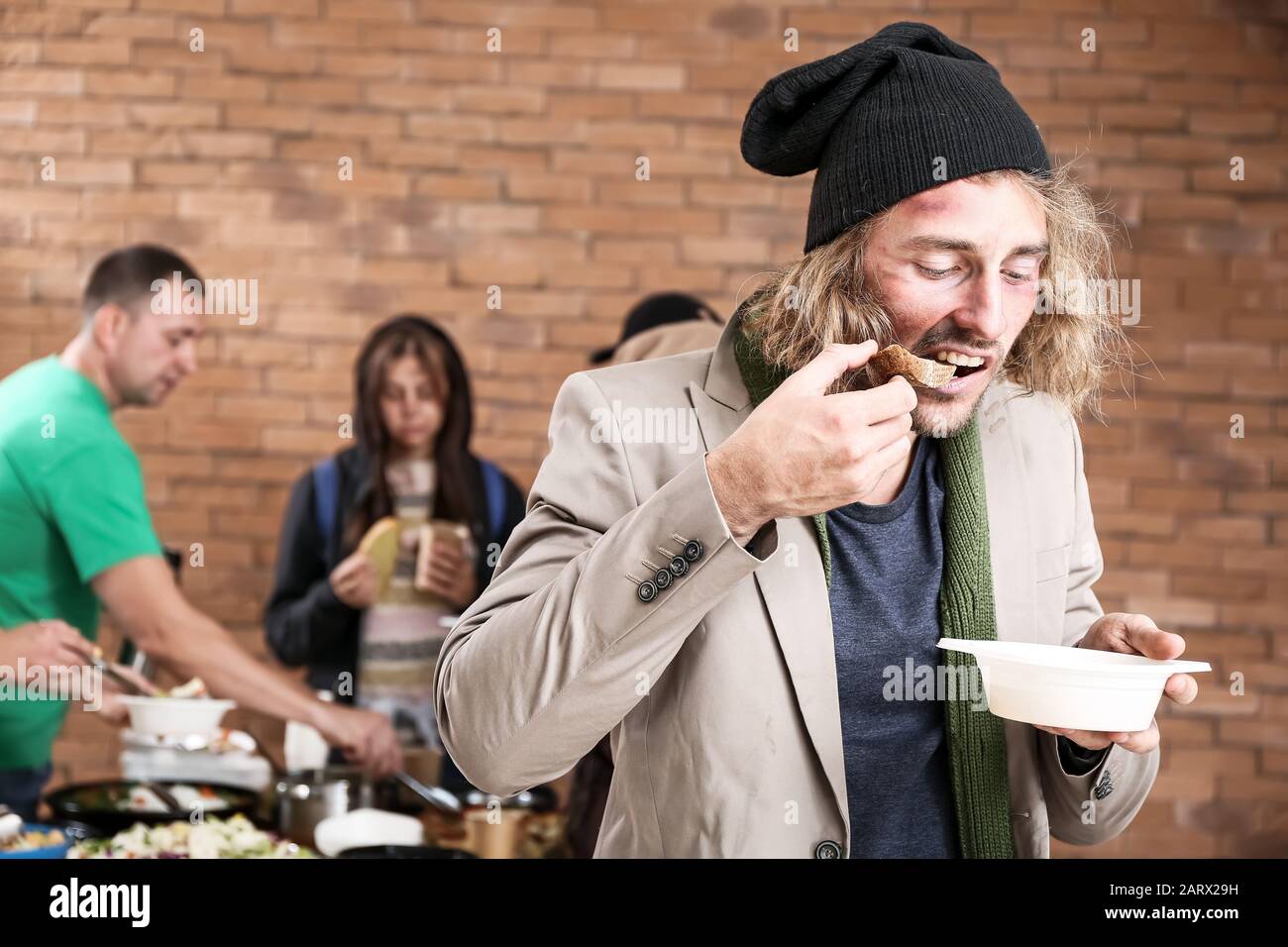 Homeless man eating hi-res stock photography and images - Alamy