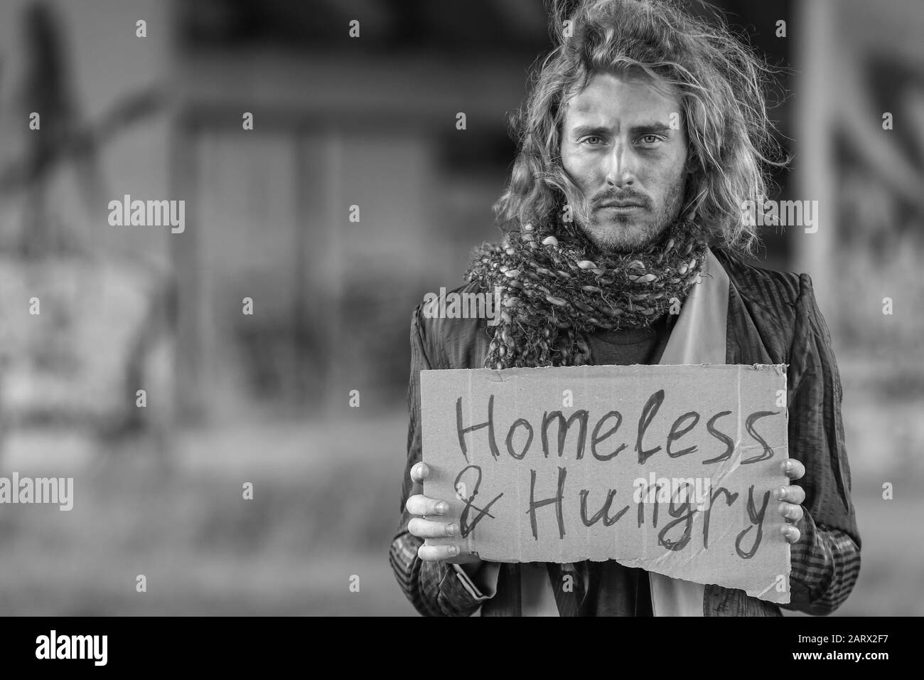 Homeless person with cardboard Black and White Stock Photos & Images ...