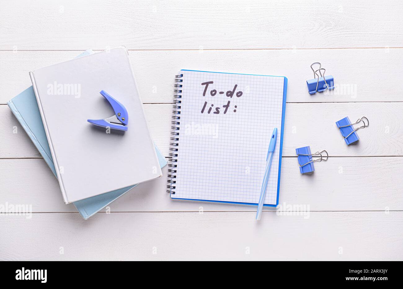 Empty to do list and stationery on white wooden background Stock Photo ...