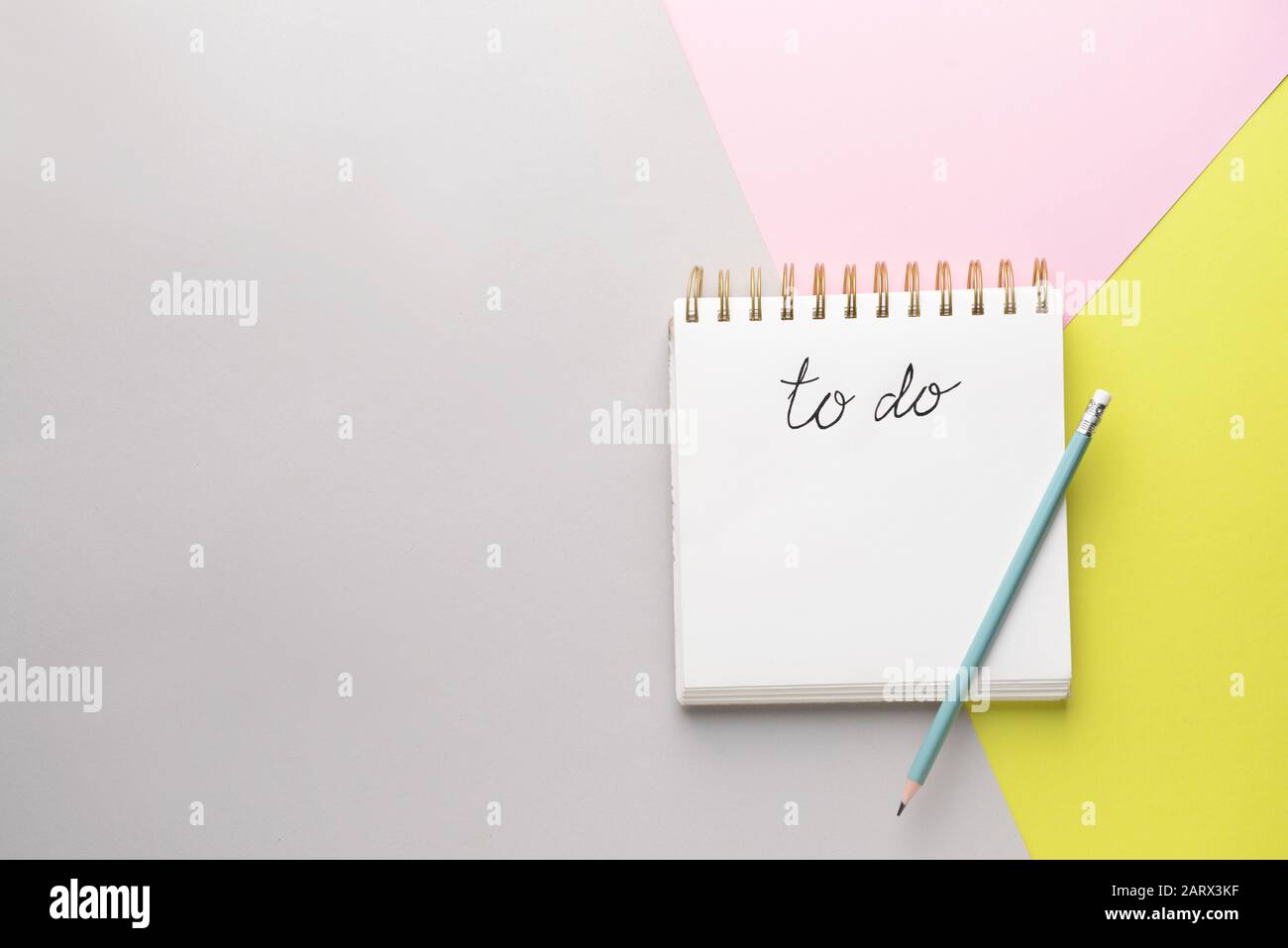 Empty to do list and pencil on color background Stock Photo - Alamy