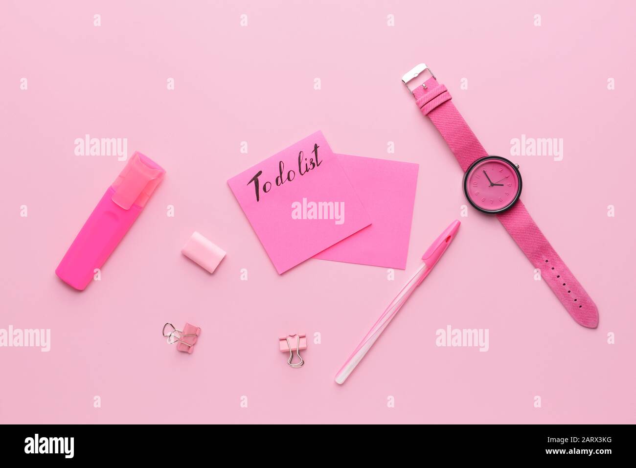 Empty to do list, watch and stationery on color background Stock Photo ...