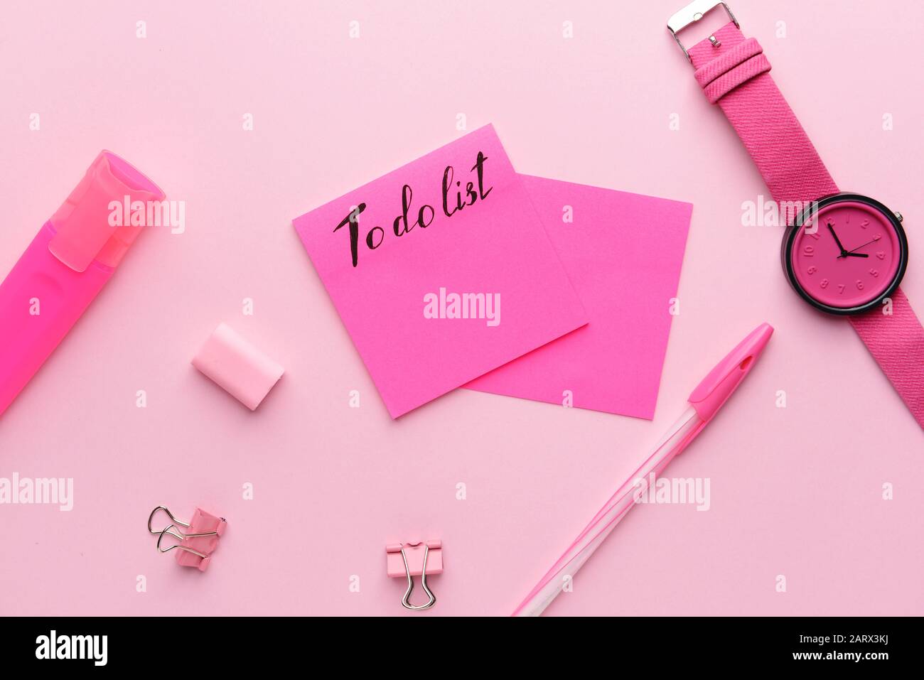Empty to do list, watch and stationery on color background Stock Photo ...
