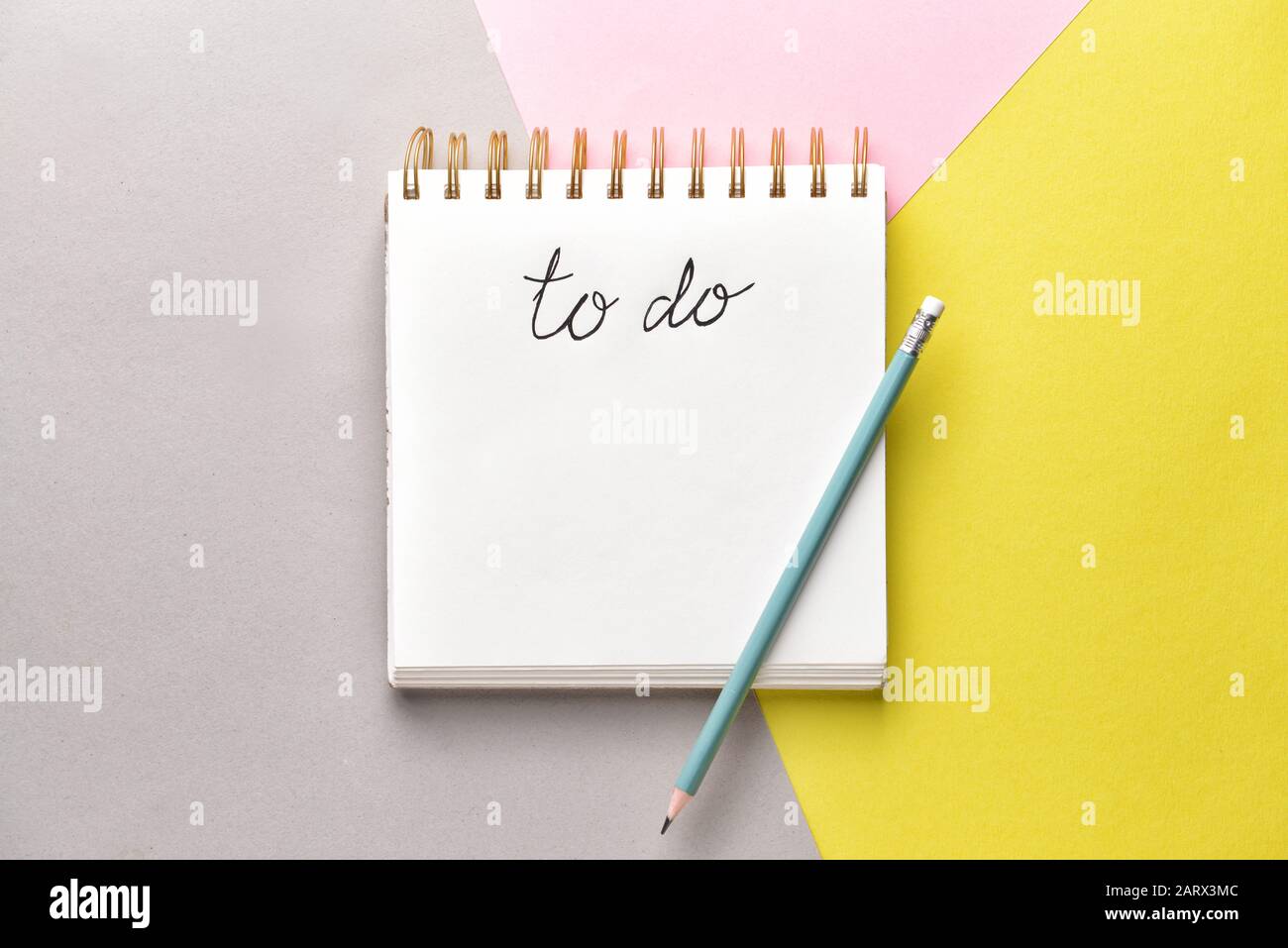 Empty to do list and pencil on color background Stock Photo - Alamy