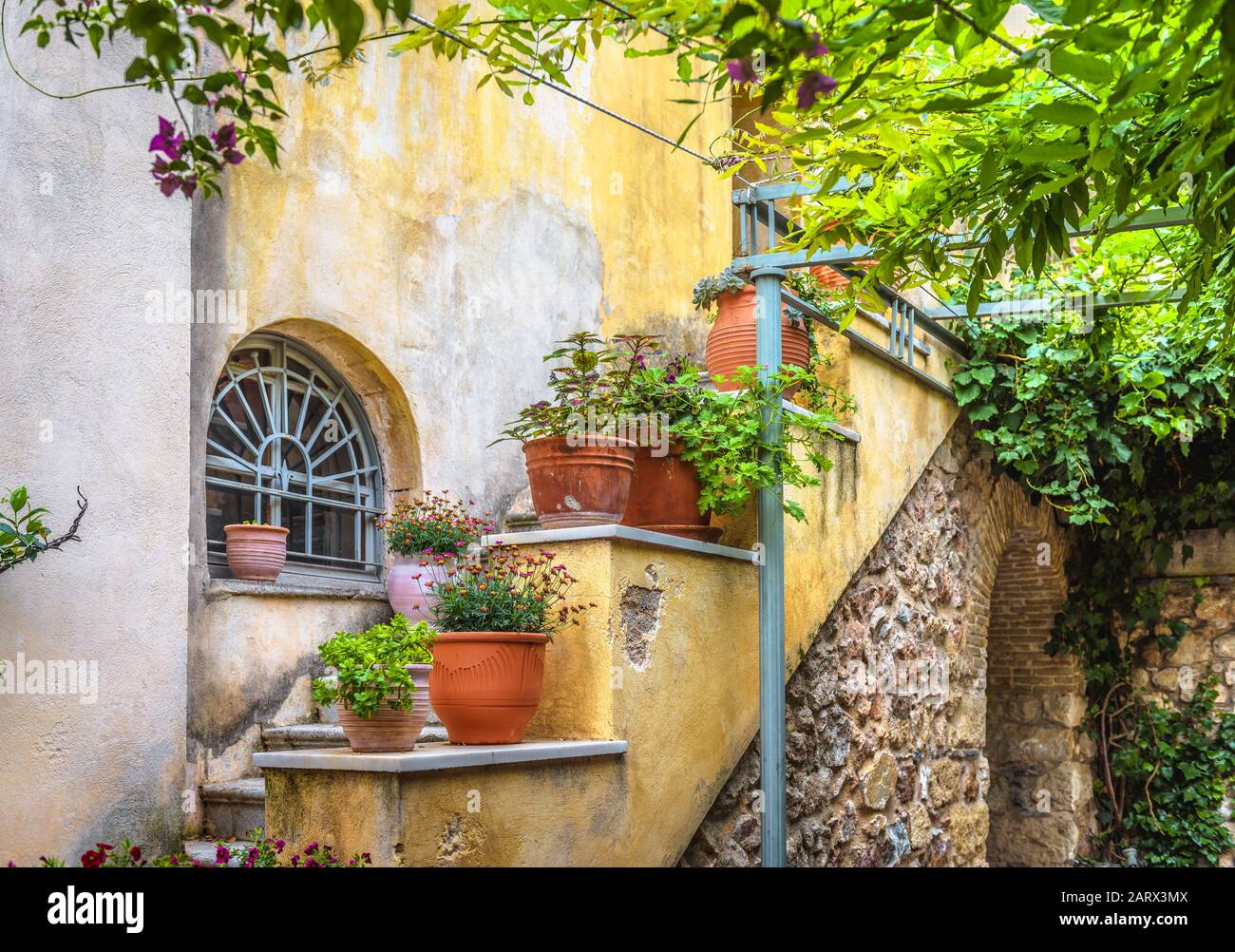 Old narrow street in Plaka district, Athens, Greece. Plaka is a famous ...