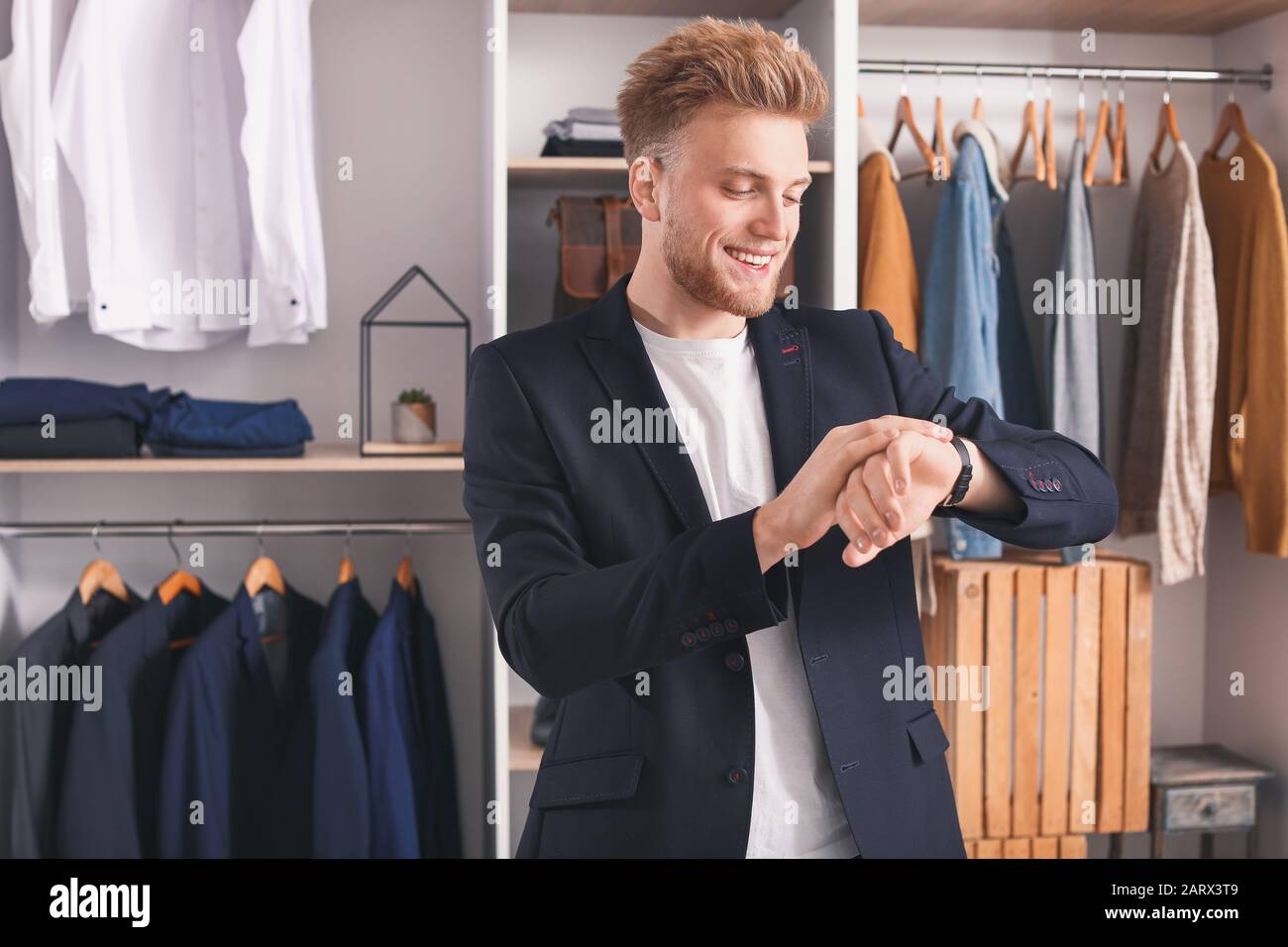 Stylish young man in dressing room Stock Photo - Alamy