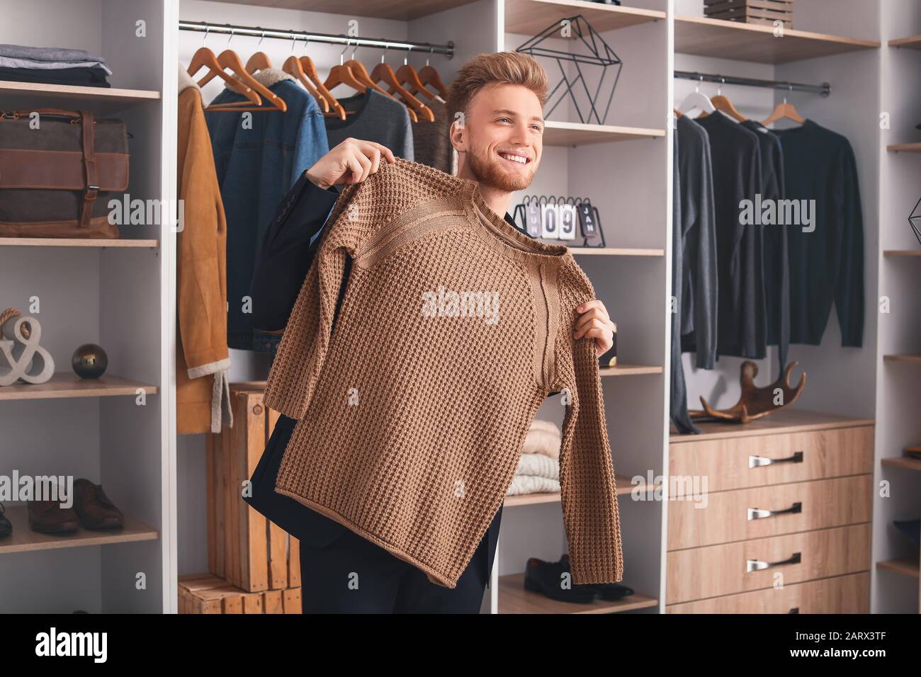 Man dressing sweater hi-res stock photography and images - Alamy
