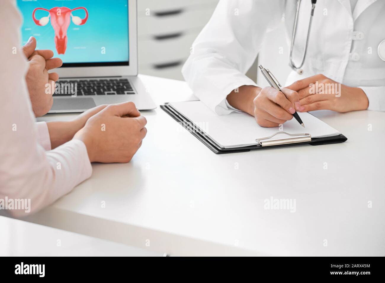Gynecologist working with patients in office Stock Photo - Alamy