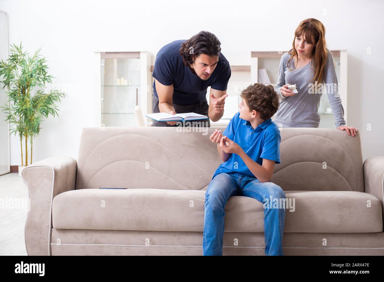 The concept of underage smoking with young boy and family Stock Photo ...