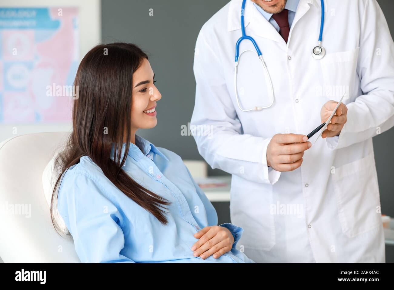 Male gynecologist working with woman in clinic Stock Photo - Alamy