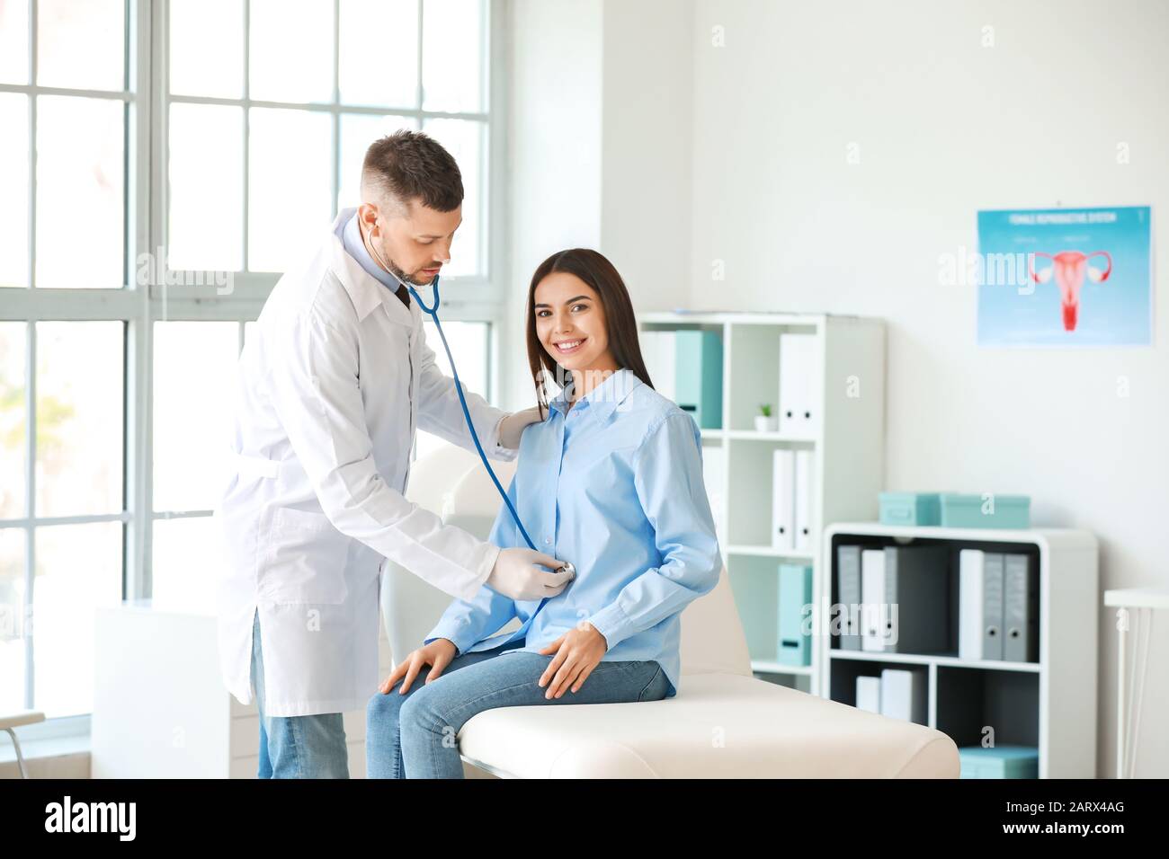 Male gynecologist working with woman in clinic Stock Photo - Alamy