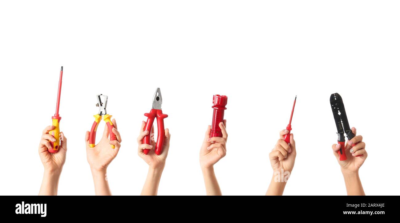 Female hands with electrician's tools on white background Stock Photo ...
