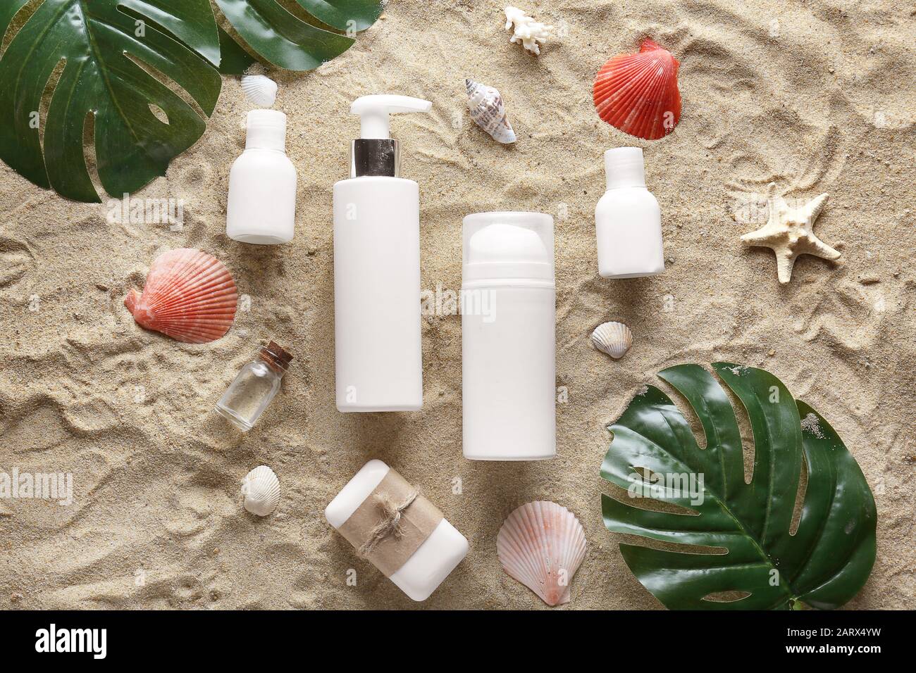 Cosmetics for personal hygiene on beach sand Stock Photo - Alamy