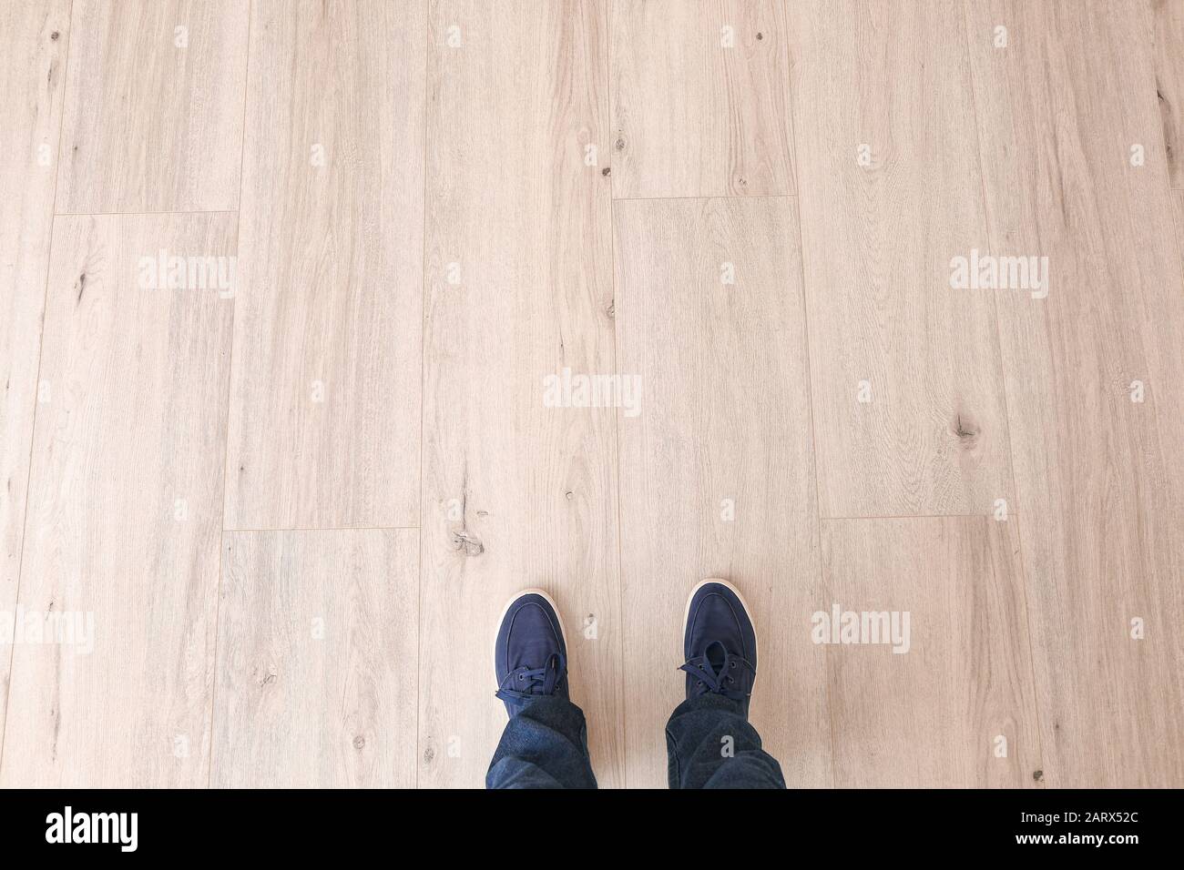 Person standing on floor, top view. Concept of choice Stock Photo - Alamy