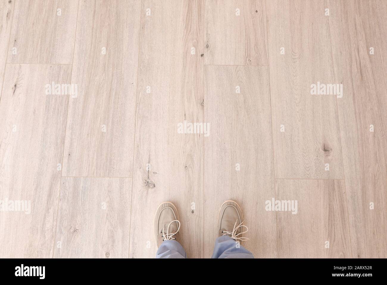 Person standing on floor, top view. Concept of choice Stock Photo - Alamy