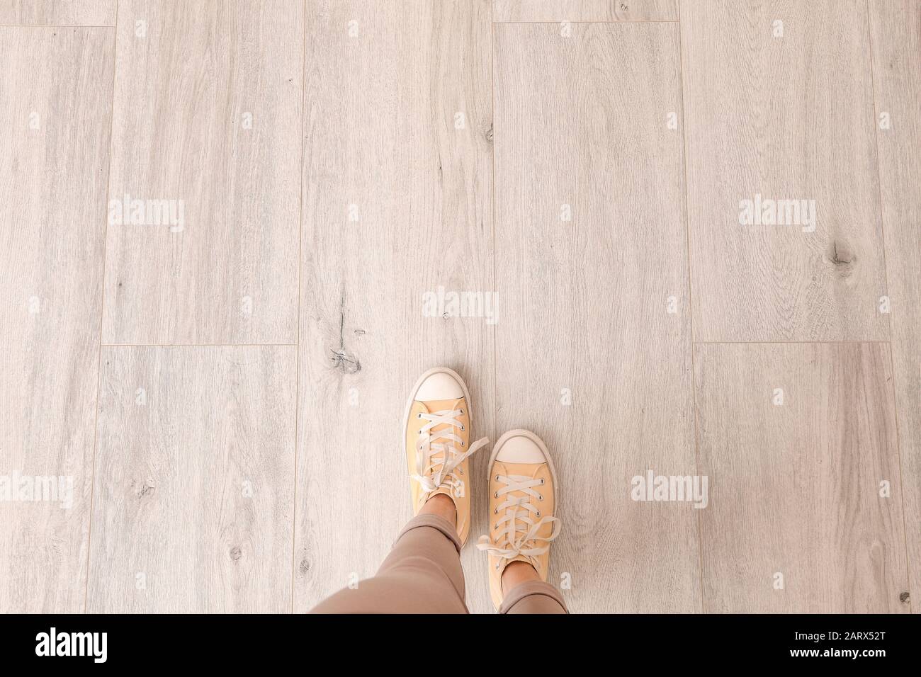 Person standing on floor, top view. Concept of choice Stock Photo - Alamy