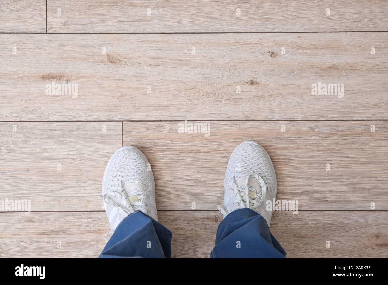 Person standing on floor, top view. Concept of choice Stock Photo - Alamy
