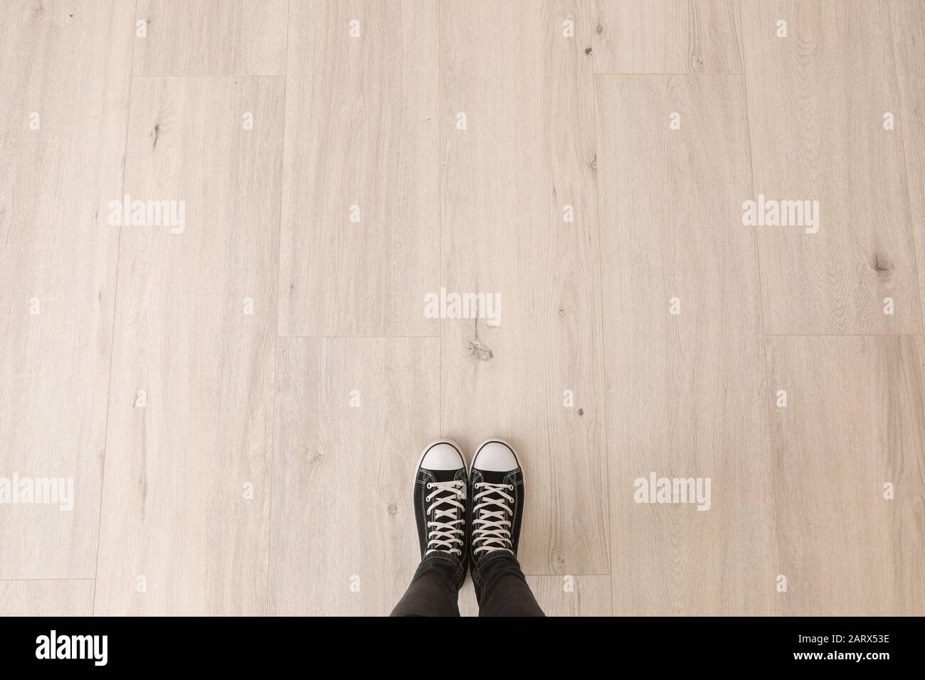 Person standing on floor, top view. Concept of choice Stock Photo - Alamy