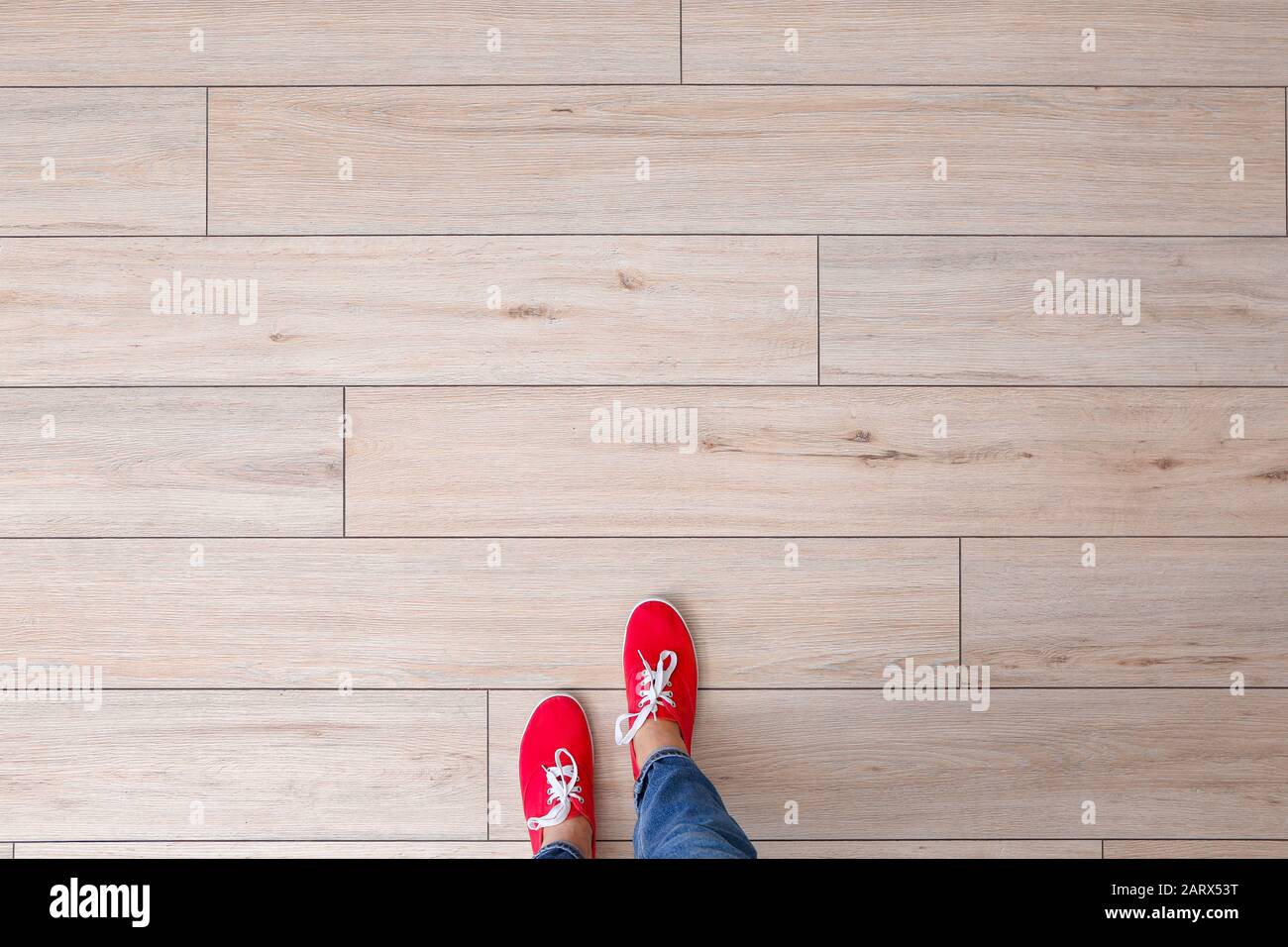 Person standing on floor, top view. Concept of choice Stock Photo - Alamy