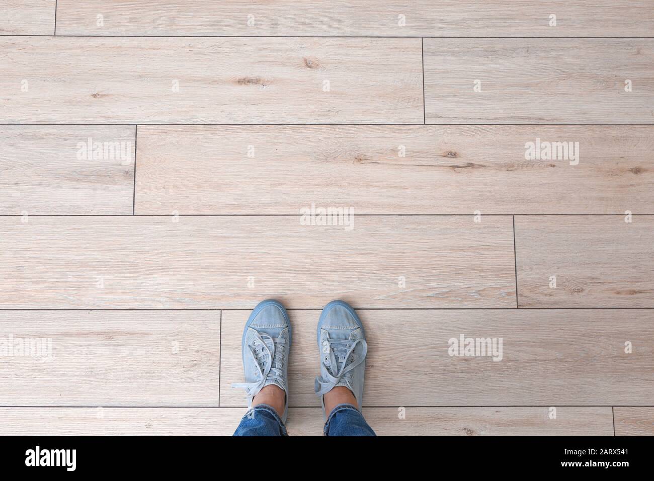 Person standing on floor, top view. Concept of choice Stock Photo - Alamy