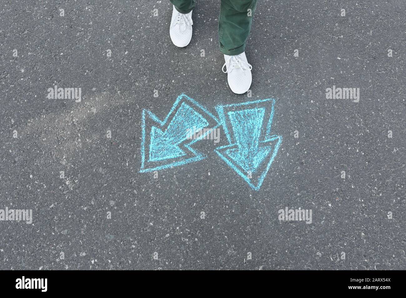 Arrows pointing at person hi-res stock photography and images - Alamy