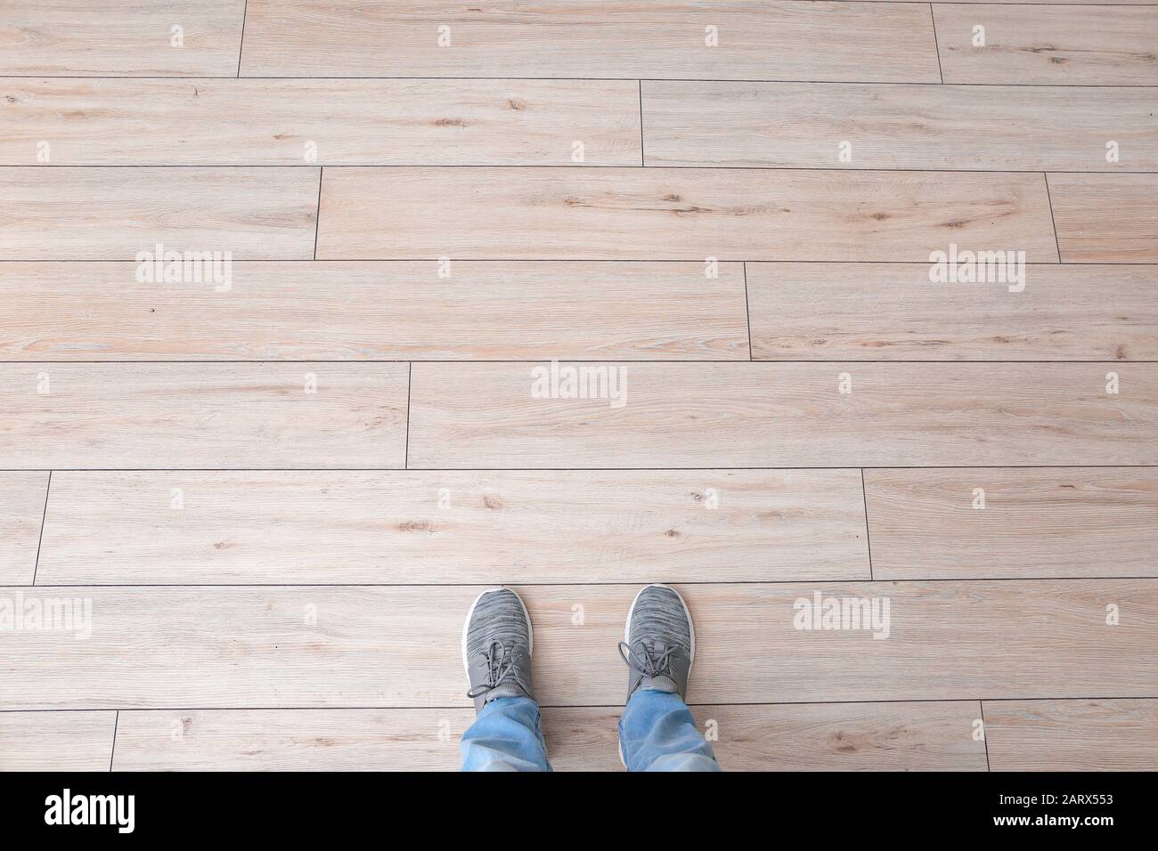 Person standing on floor, top view. Concept of choice Stock Photo - Alamy
