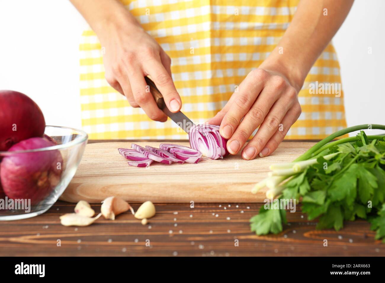 Young woman cutting red onion hi-res stock photography and images - Alamy