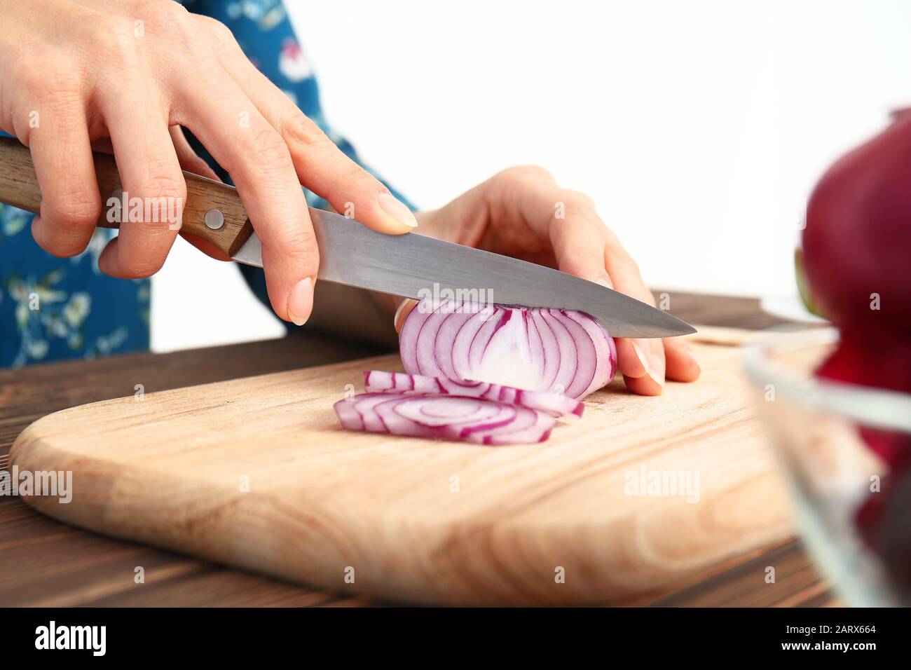 Woman cutting onion in hi-res stock photography and images - Alamy