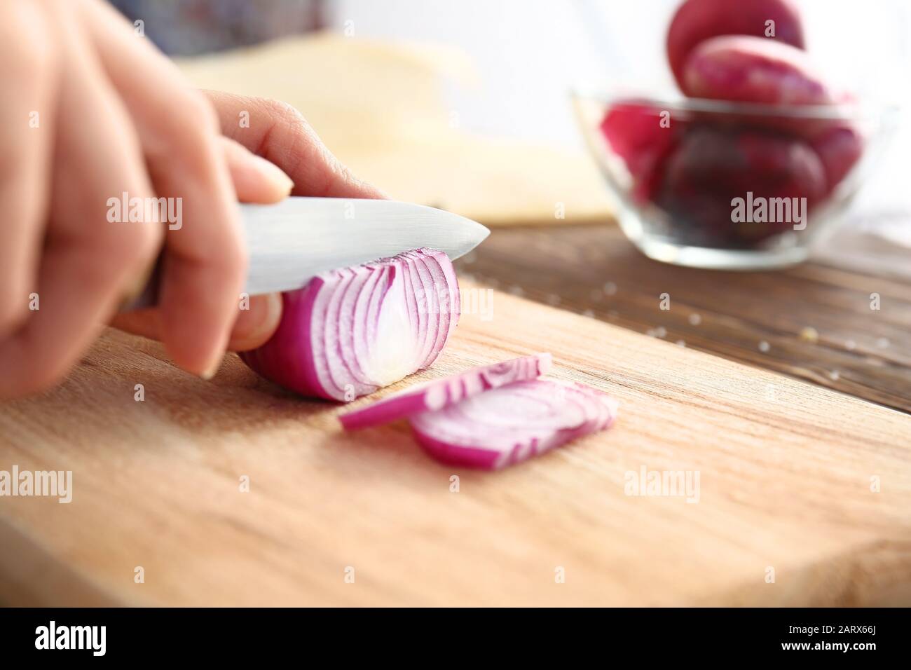Woman cutting onion in hi-res stock photography and images - Alamy