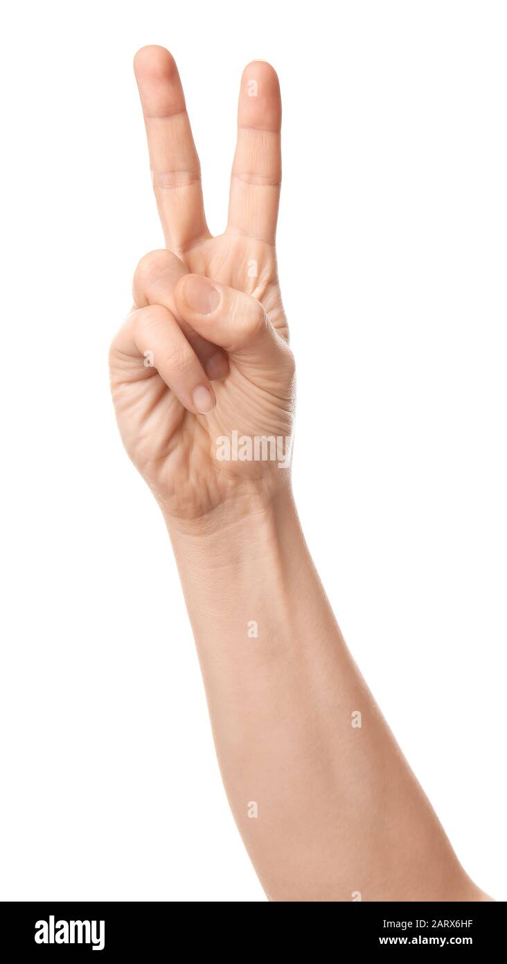 Hand of woman showing victory gesture on white background Stock Photo ...