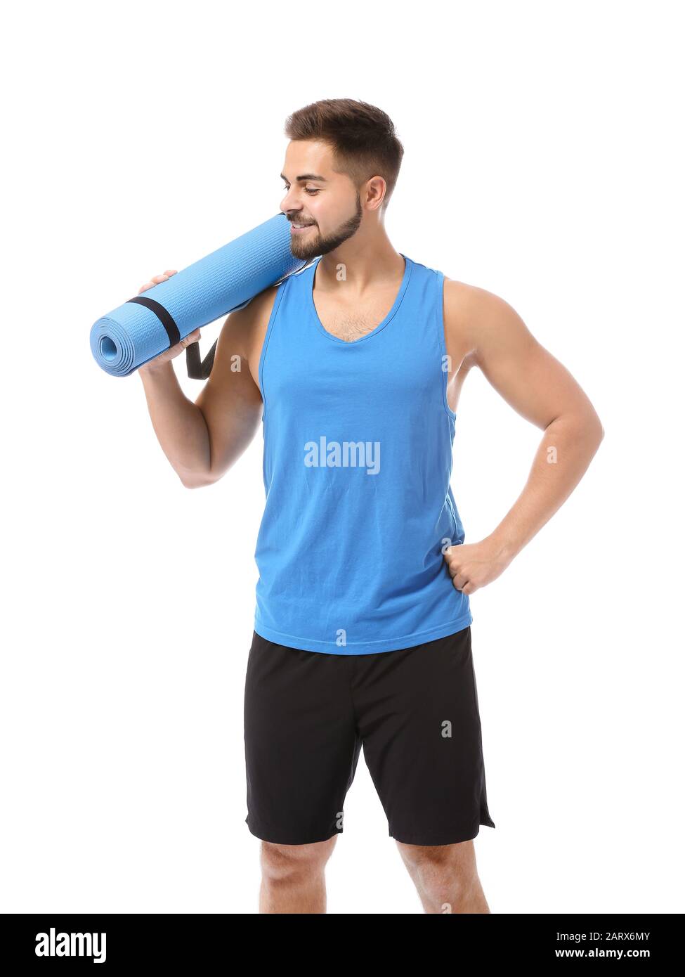 Sporty young man with yoga mat on white background Stock Photo - Alamy