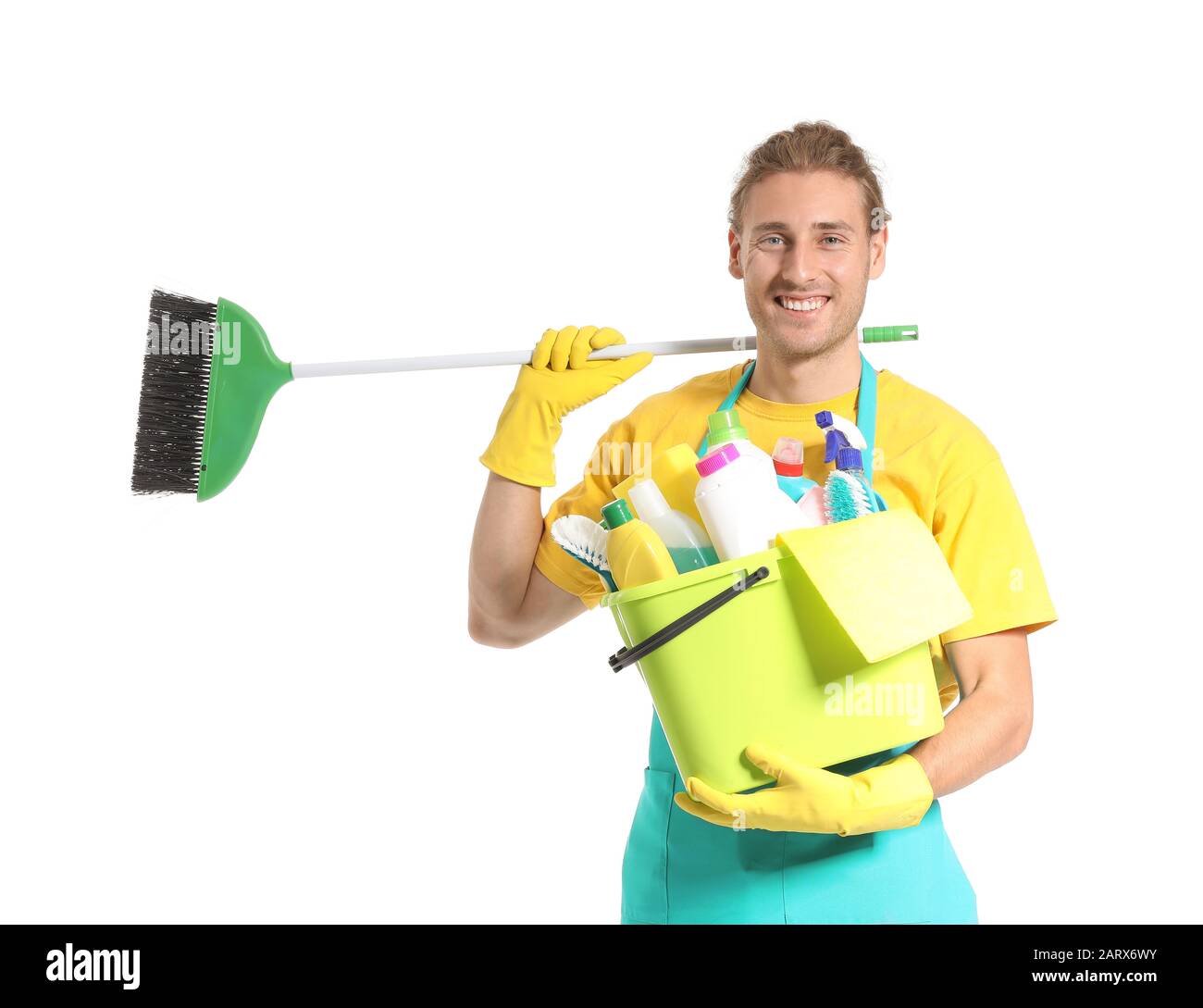 Male janitor with cleaning supplies on white background Stock Photo - Alamy