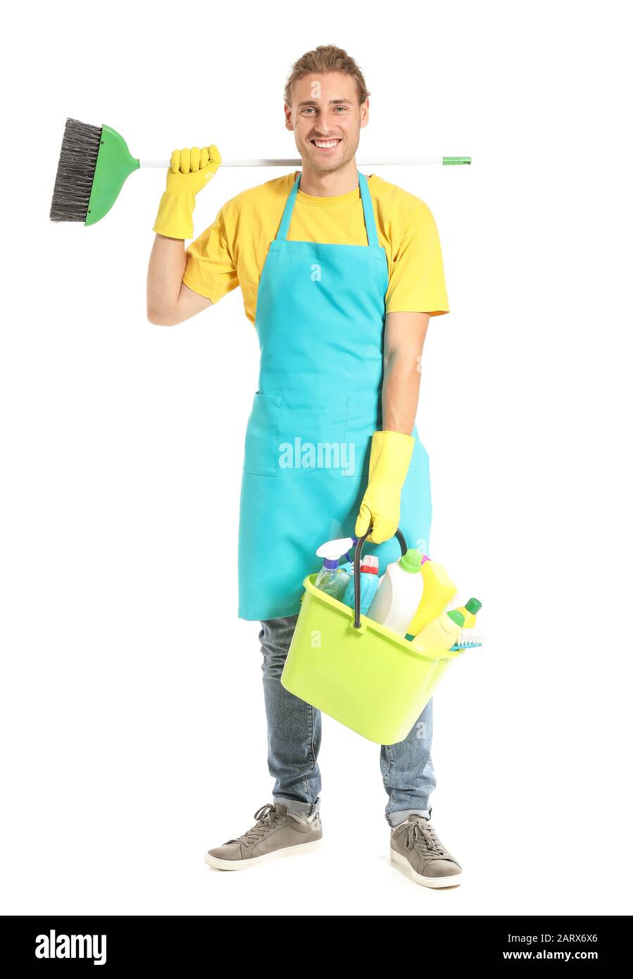Male janitor with cleaning supplies on white background Stock Photo - Alamy