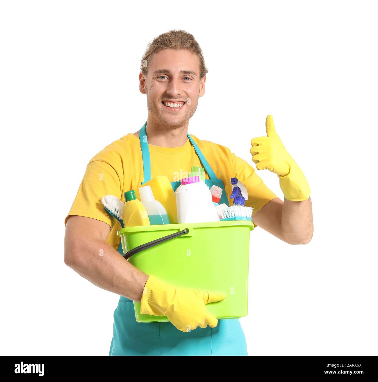 Male janitor with cleaning supplies showing thumb-up on white ...