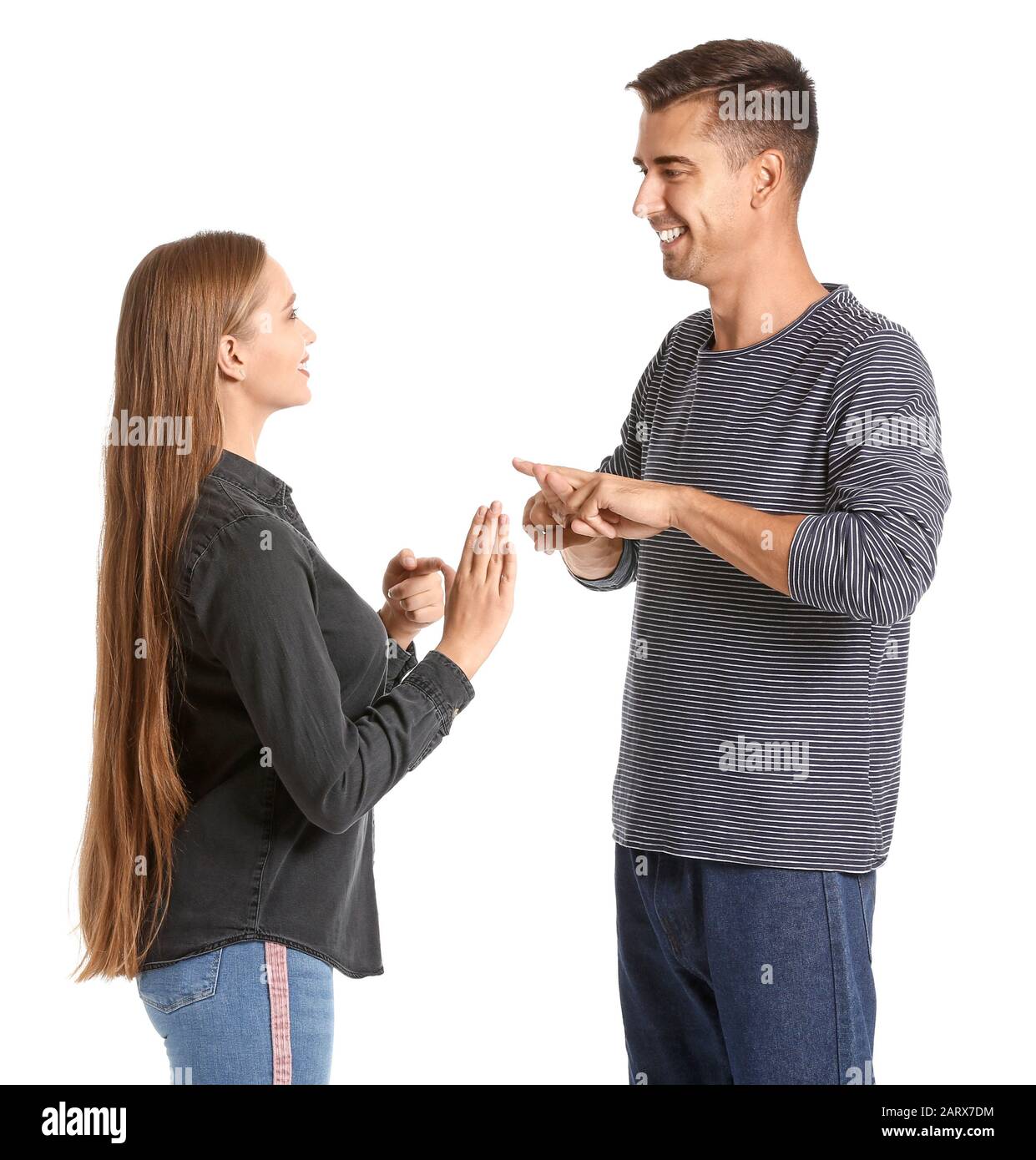 Young deaf mute couple using sign language on white background Stock ...