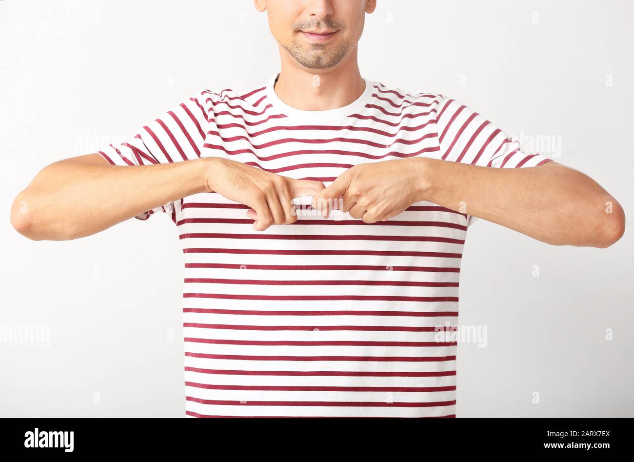 Young deaf mute man using sign language on white background Stock Photo ...