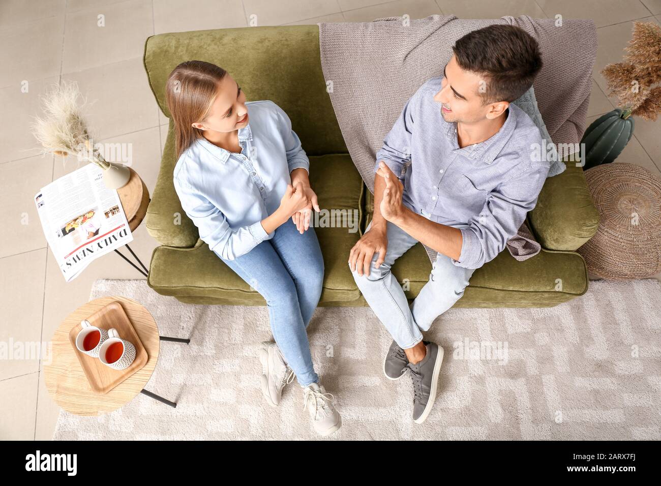 Young deaf mute couple using sign language at home Stock Photo - Alamy