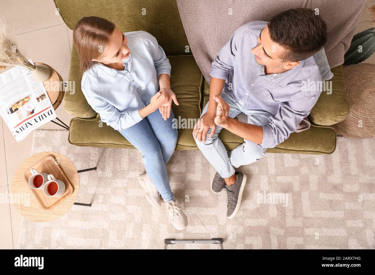 Young deaf mute couple using sign language at home Stock Photo - Alamy